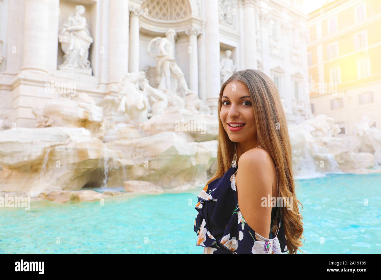Beautiful young fashion model posing in front of Trevi Fountain in Rome ...