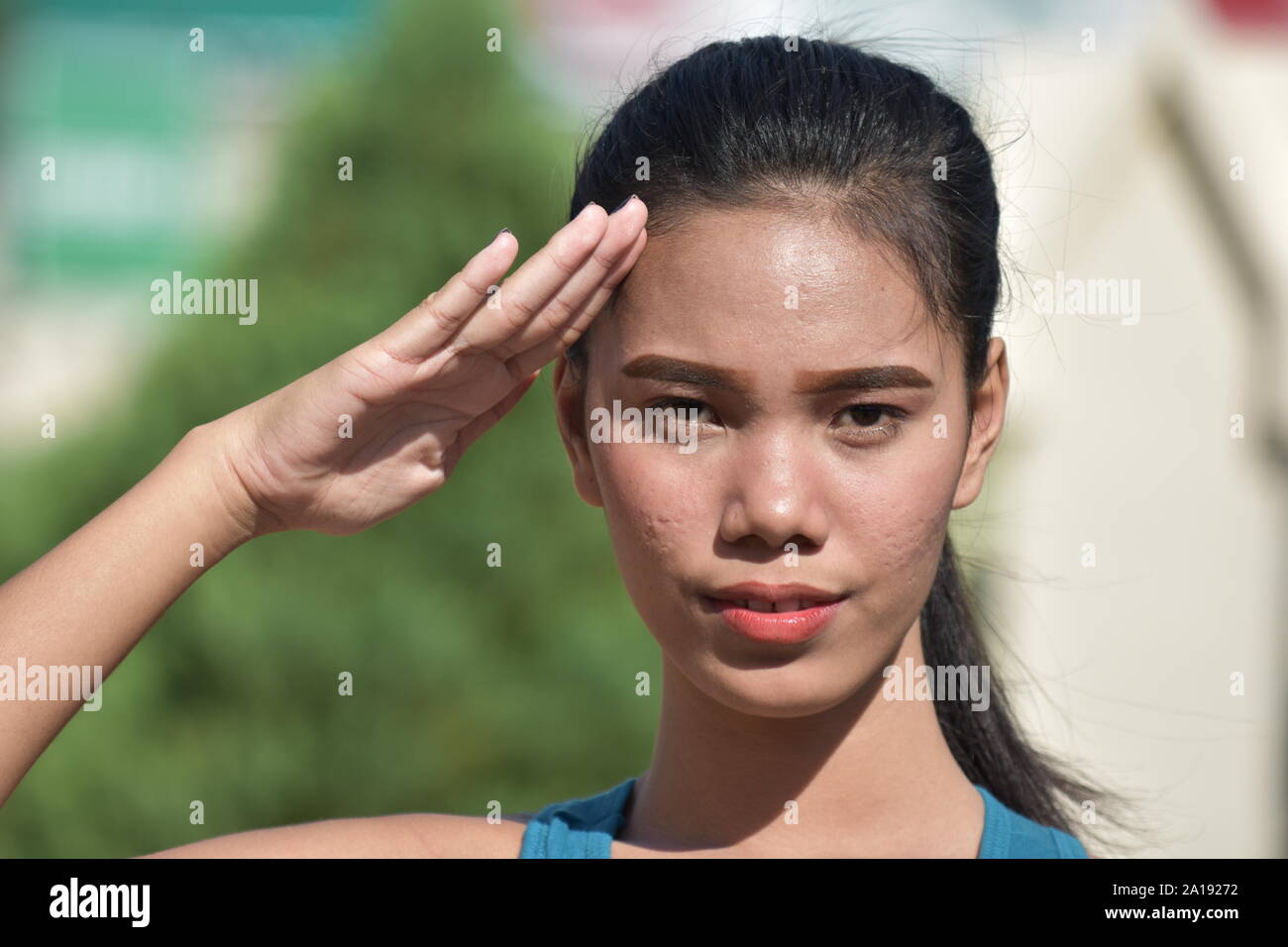 A Pretty Female Saluting Stock Photo - Alamy