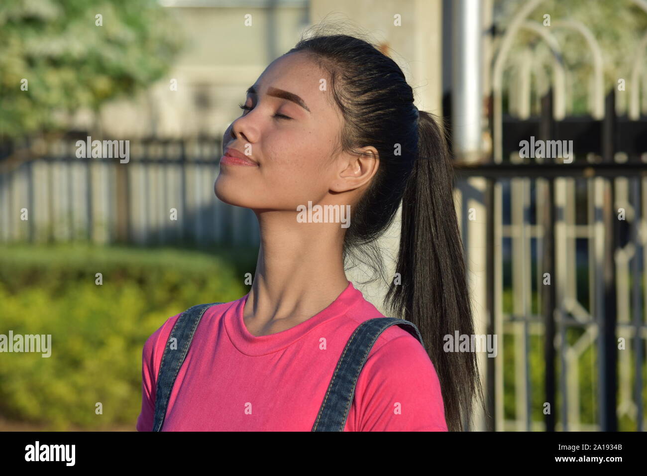 A Young Asian Female Wondering Stock Photo - Alamy