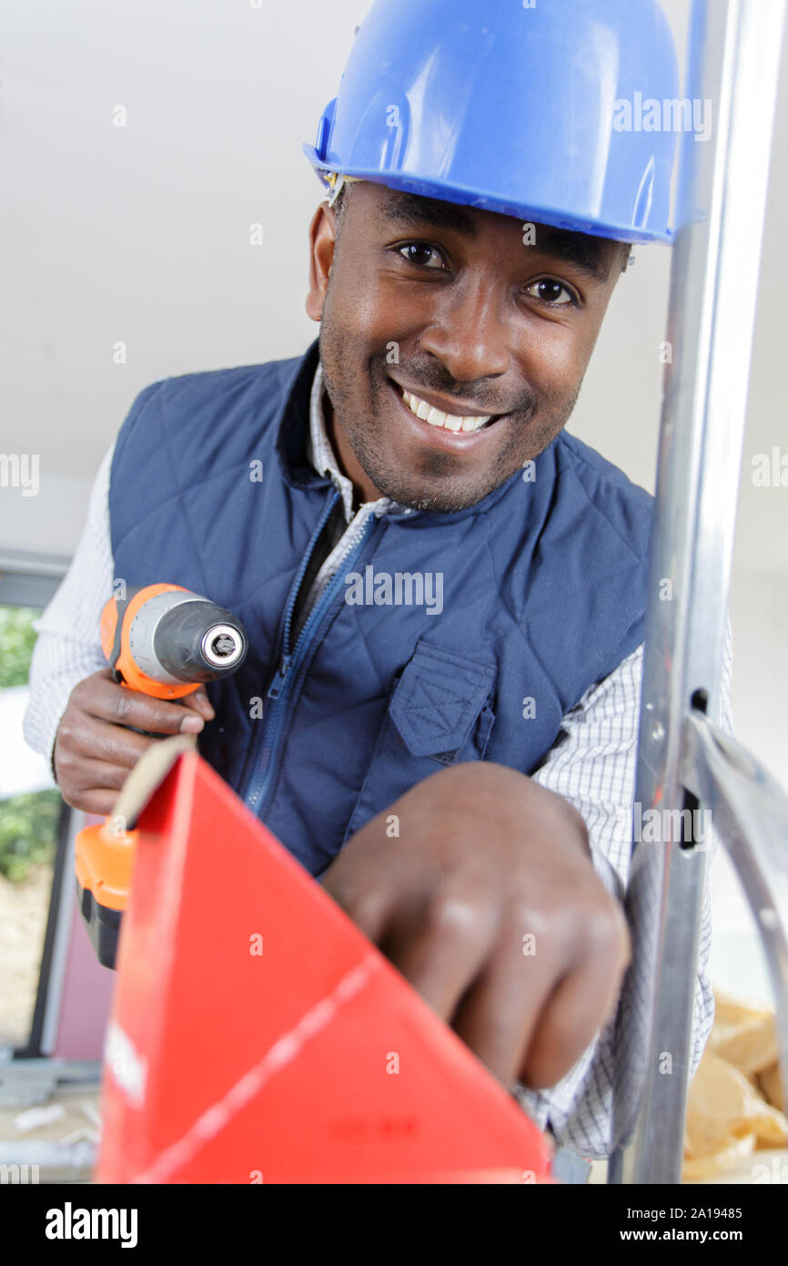 Hand reaching for red ladder hi-res stock photography and images - Alamy