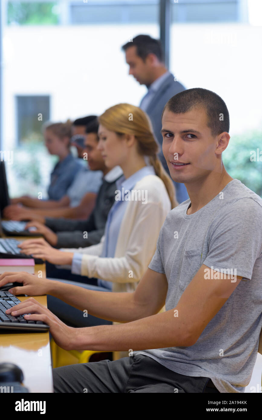 portrait of young businessman in accounting classroom Stock Photo - Alamy
