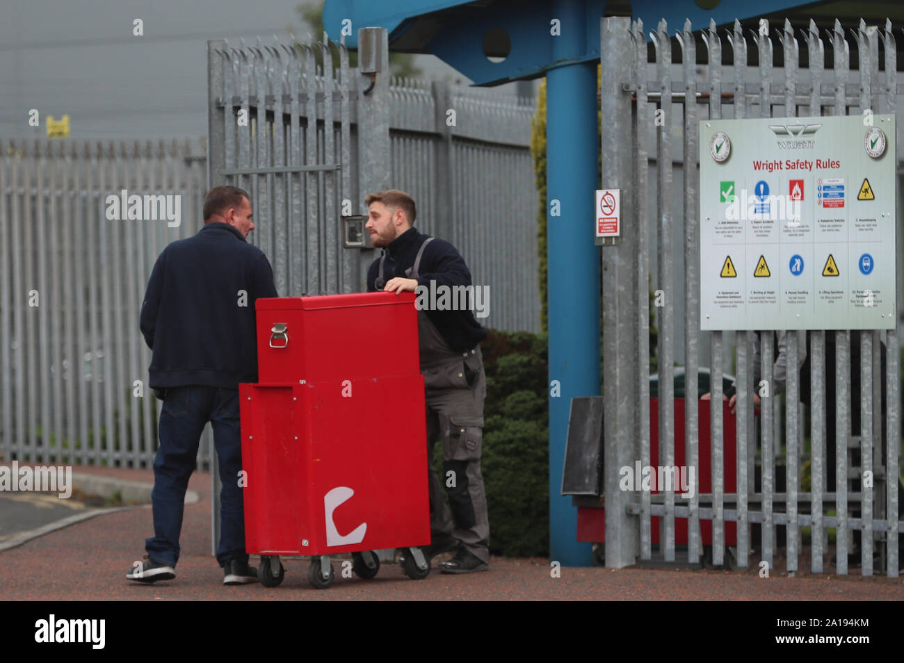 Workers leave the Wrightbus Chassis plant in Antrim, Northern Ireland ...