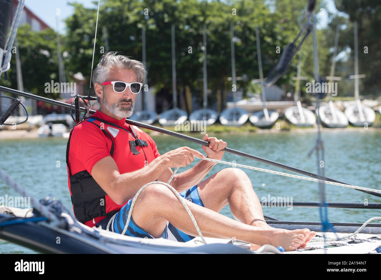 a sailing man on boat Stock Photo - Alamy