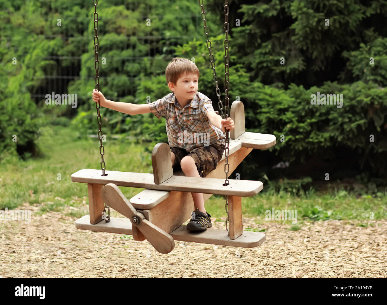 Kid swing plane hi-res stock photography and images - Alamy