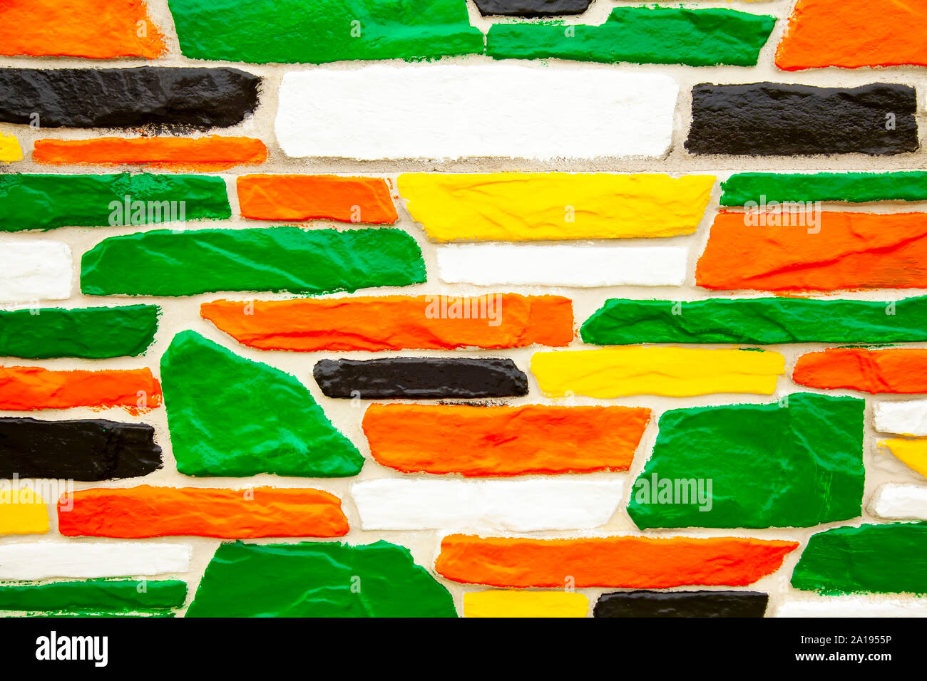 Multicolor textured brick wall close up Stock Photo - Alamy
