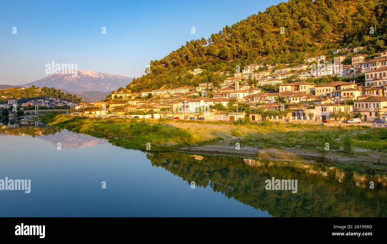 Reflection at the old ottoman bridge in historic Old Town Berat, UNESCO ...