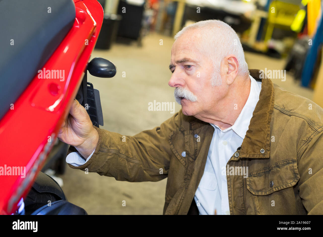 checking the engine of a motorcycle Stock Photo - Alamy