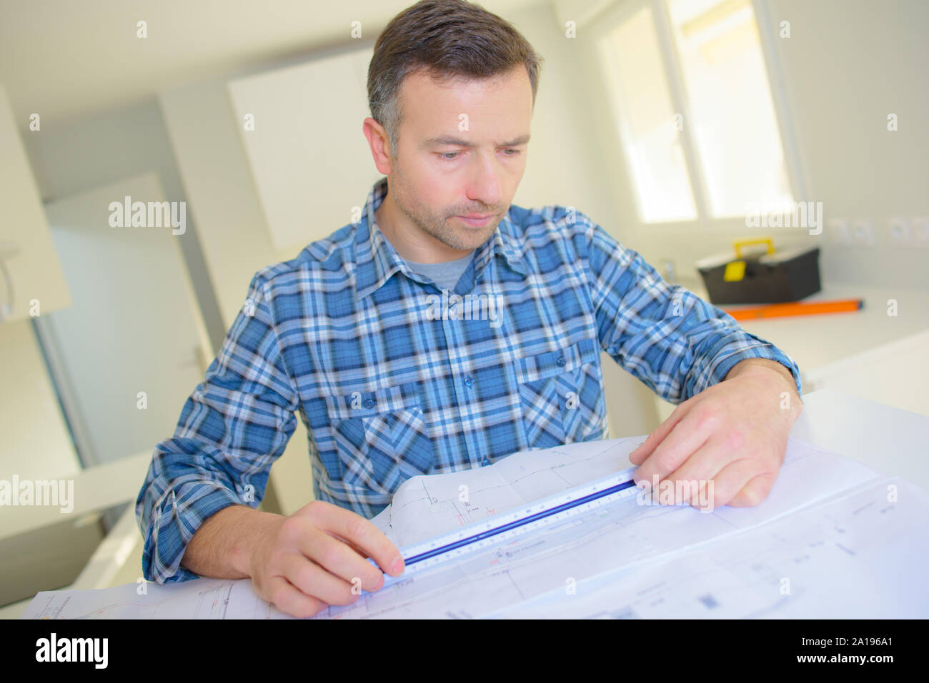 architect man working with blueprints Stock Photo - Alamy