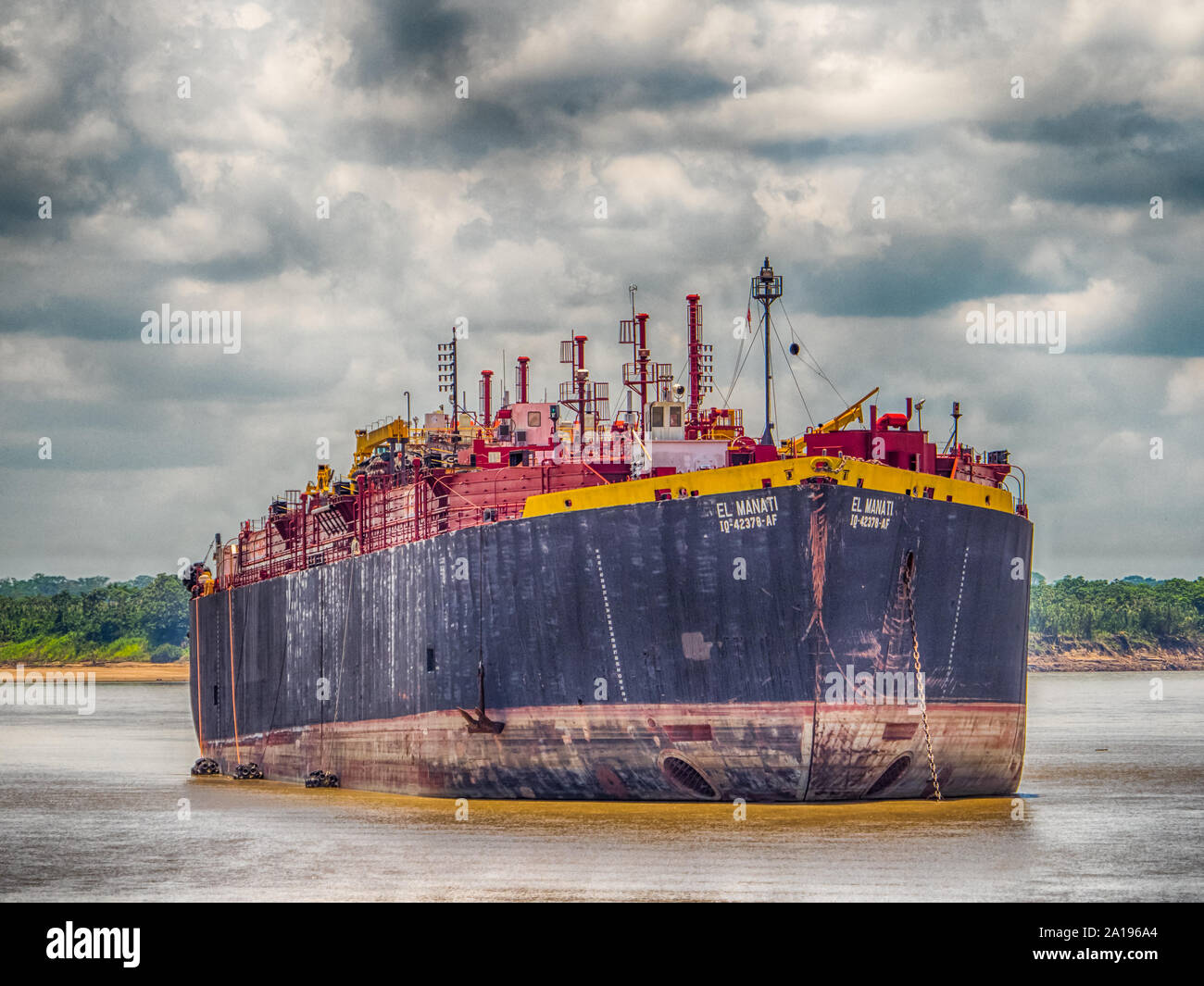 Oceanic ship and local boat on the Amazon River over 3,000 km from the ...