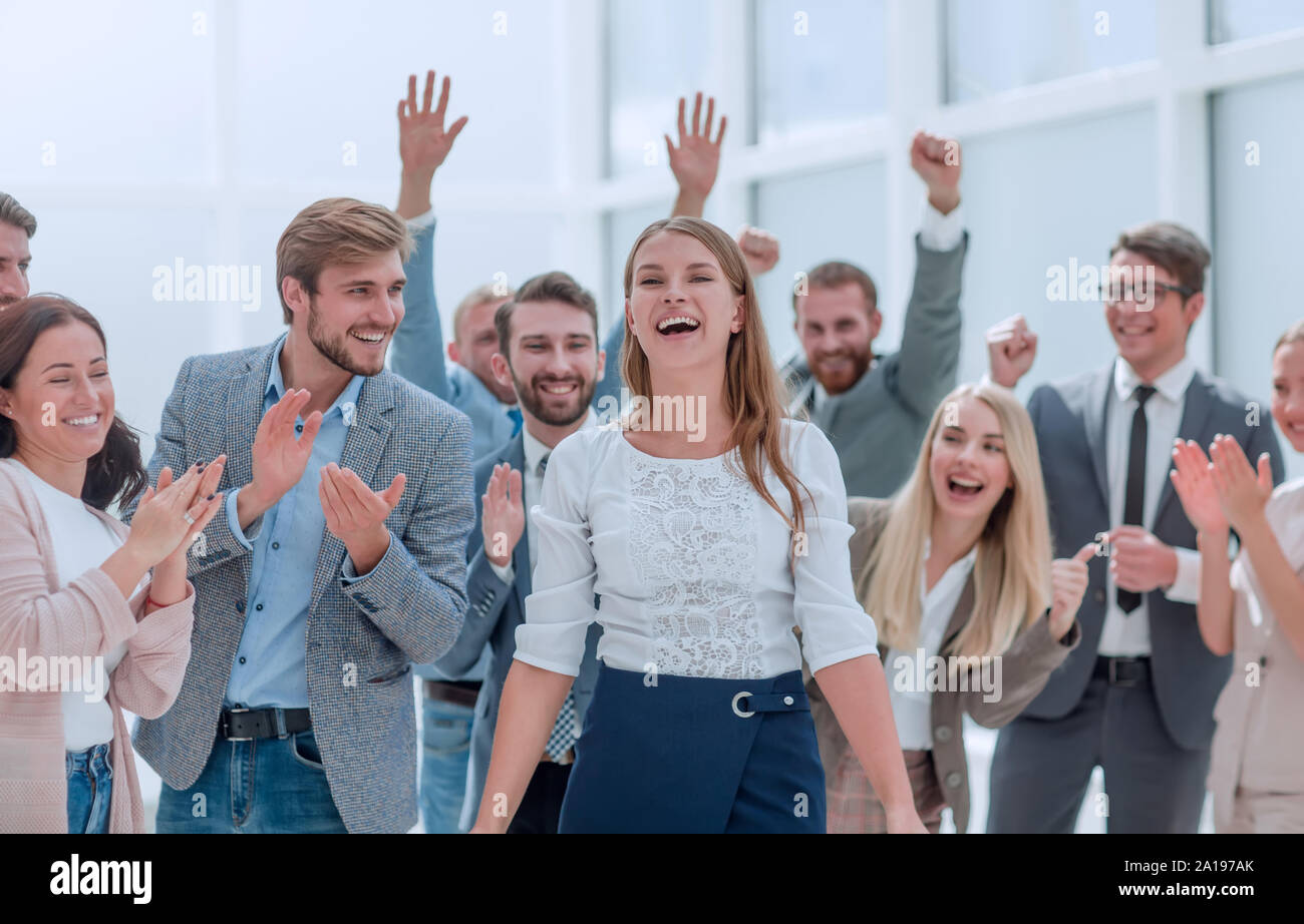 happy business team giving each other a high five Stock Photo - Alamy