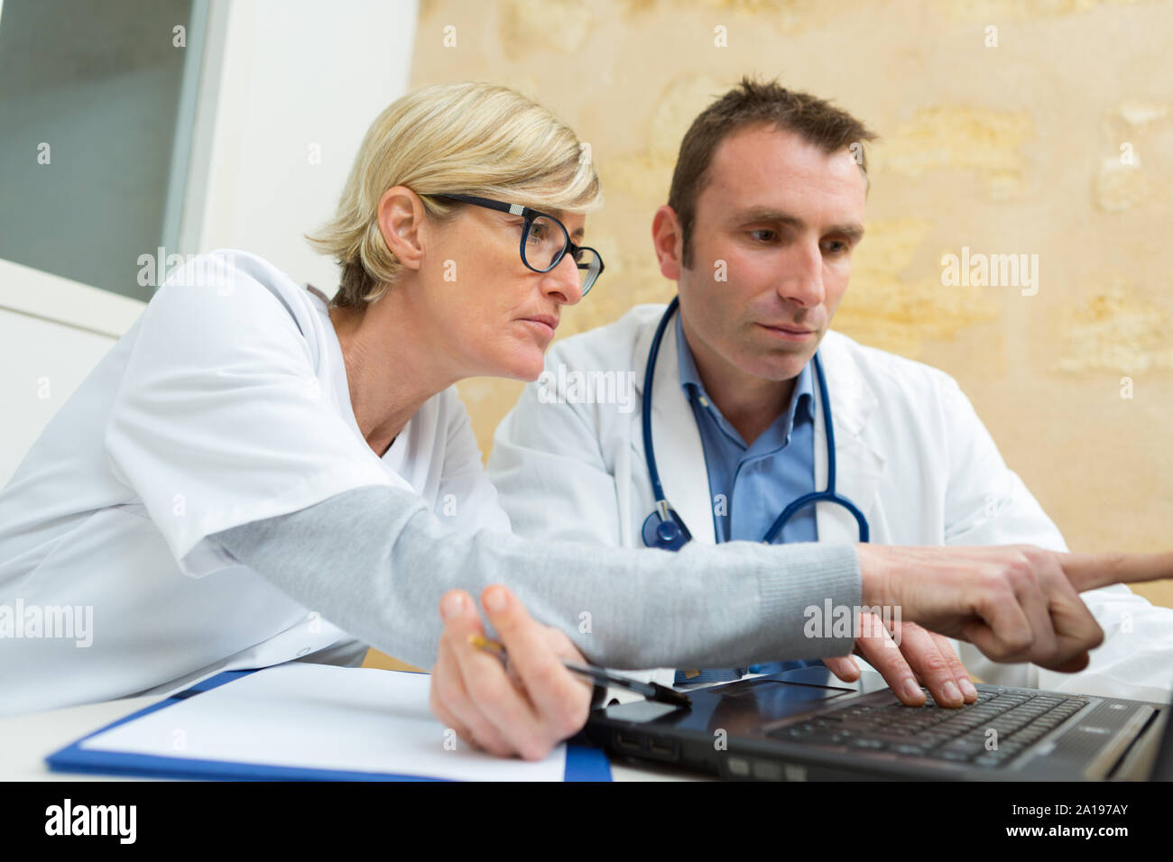 radiation specialist pointing at an anomaly in the result Stock Photo ...