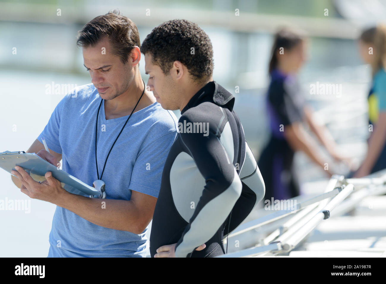 two men getting ready before sailing a boat Stock Photo - Alamy