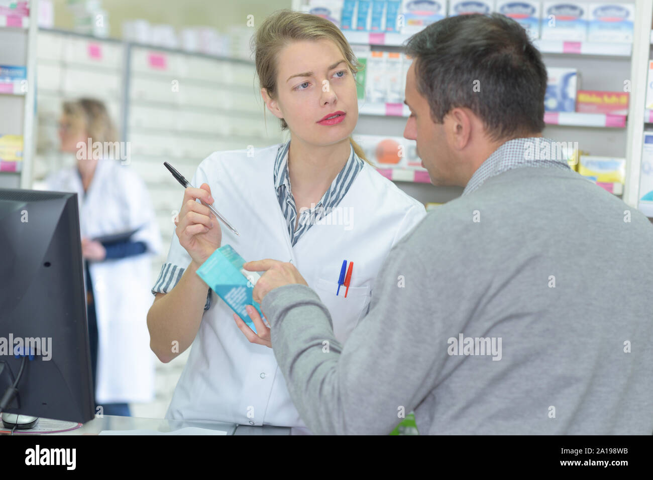 angry client in a pharmacy Stock Photo - Alamy