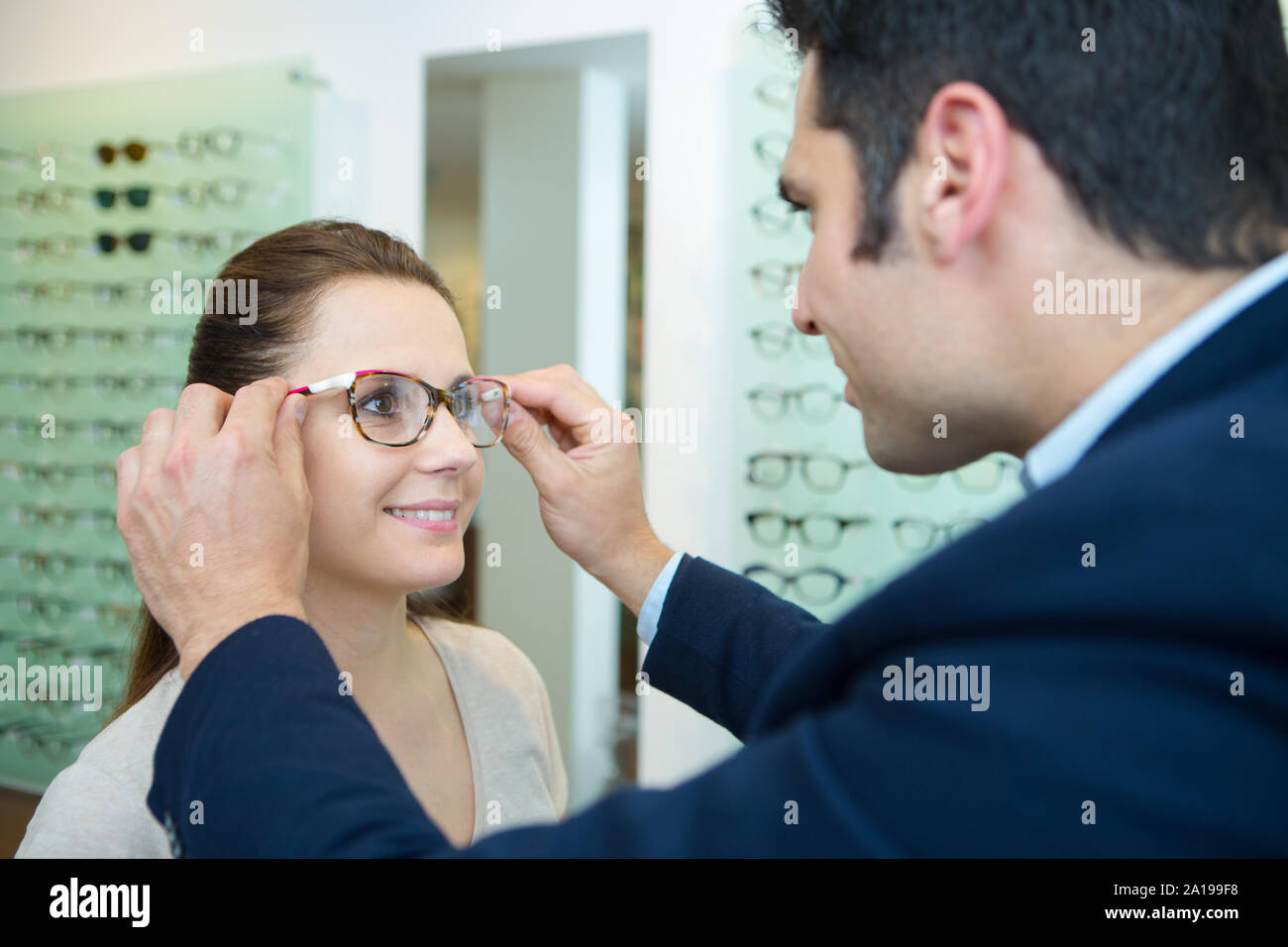 Girl trying glasses hi-res stock photography and images - Alamy