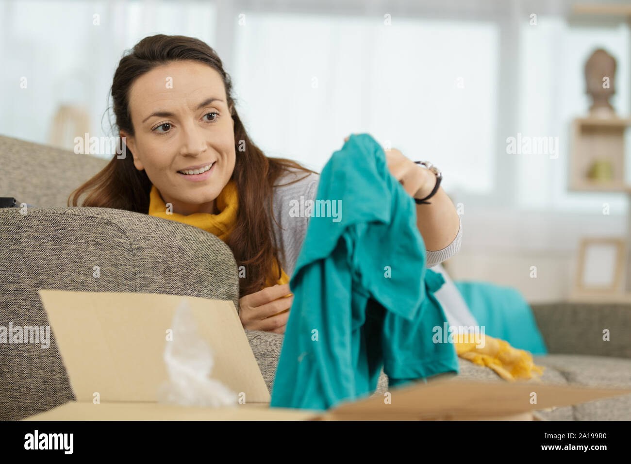 Girl opening cardboard box hi-res stock photography and images - Alamy