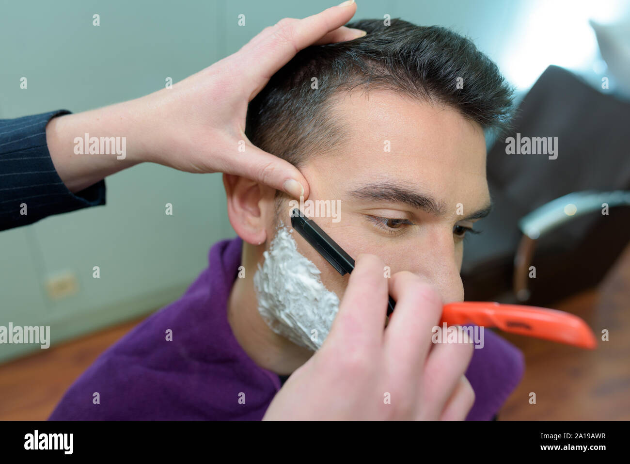 portrait of barber shaving mans chin Stock Photo - Alamy