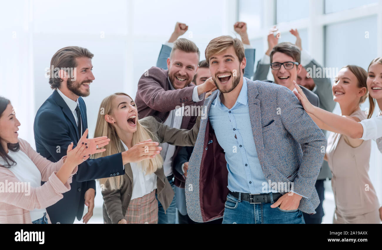 corporate group of employees applauding their colleague Stock Photo - Alamy