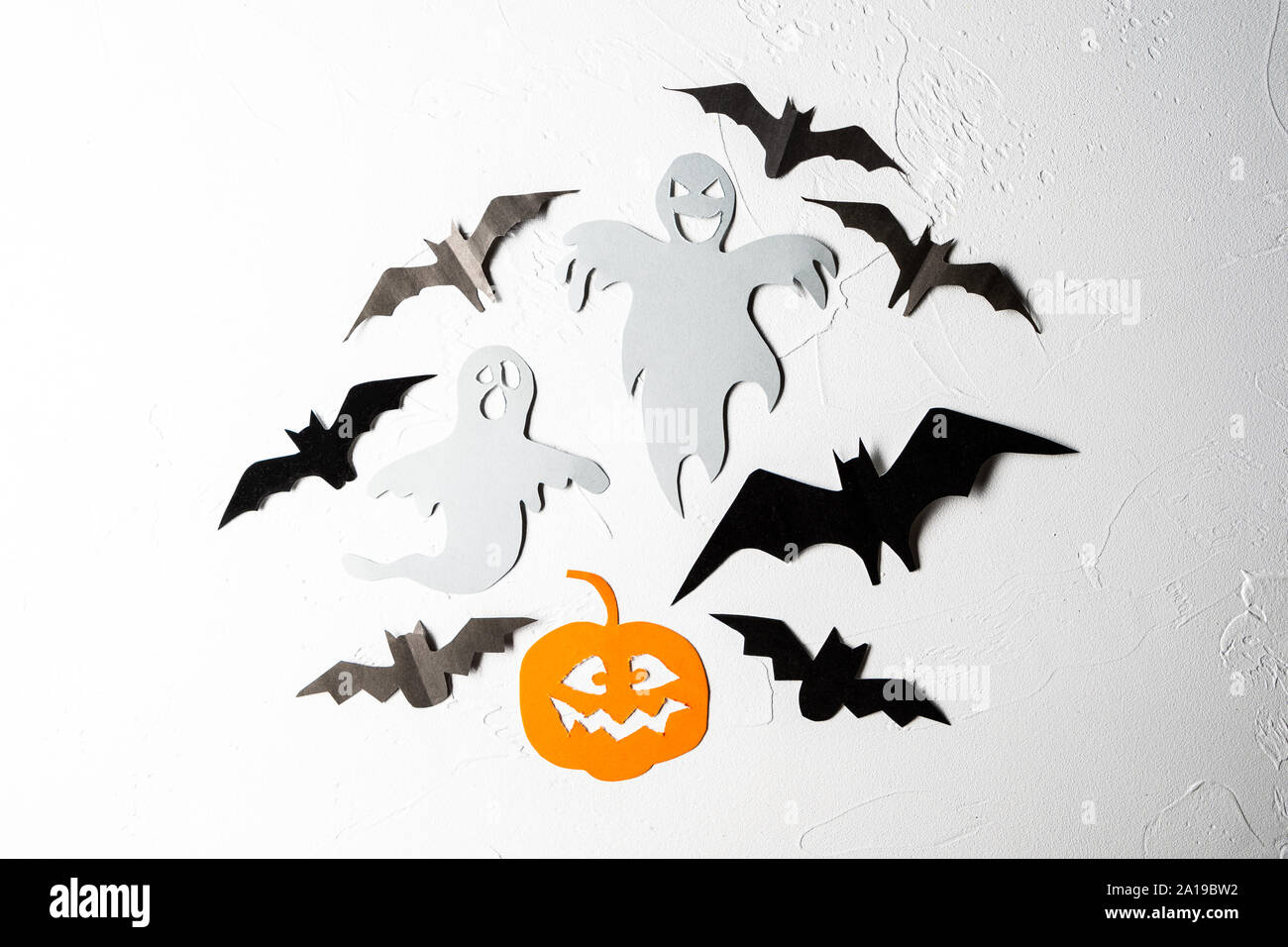 Photo of paper pumpkin, ghost, bats on white background Stock Photo - Alamy