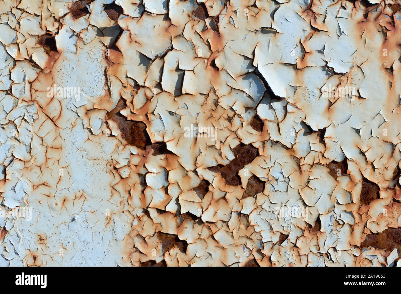 rusty metal wall with cracked blue paint, rust through the paint Stock ...