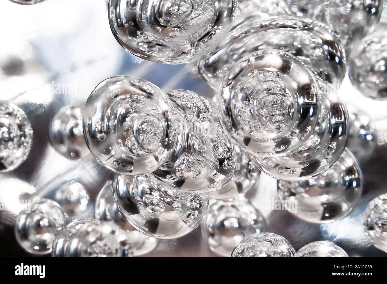 Illuminated Bubbles Floating in Clear Liquid Seen Through Scratched ...