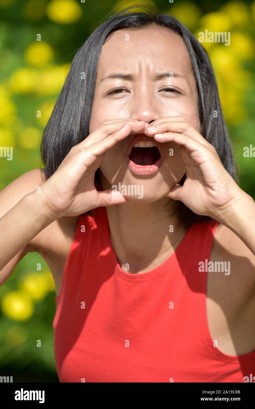 A Youthful Filipina Woman Shouting Stock Photo - Alamy