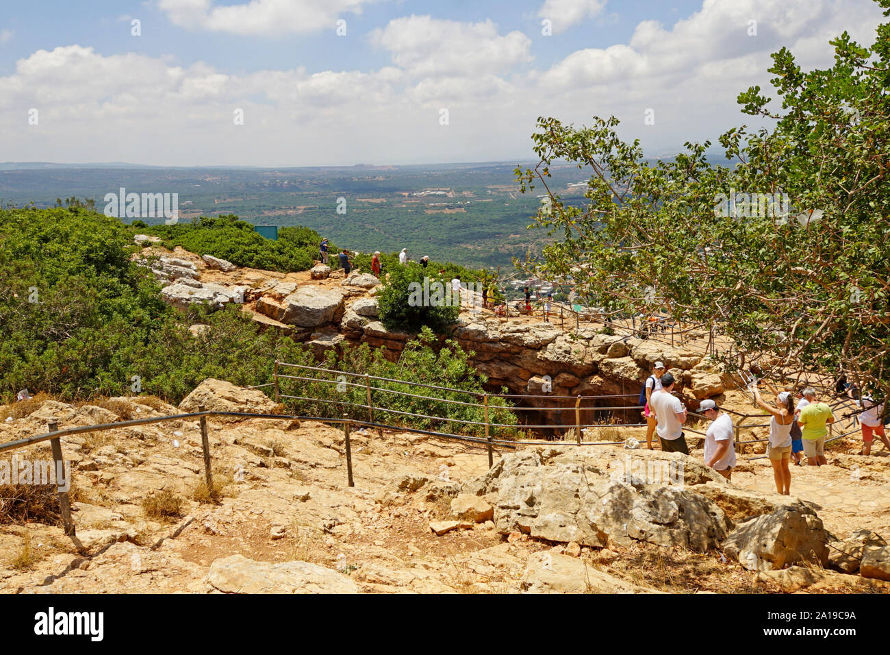 Hikers at the Keshet Cave (Arch Cave) in Adamit Park, Western Galilee ...