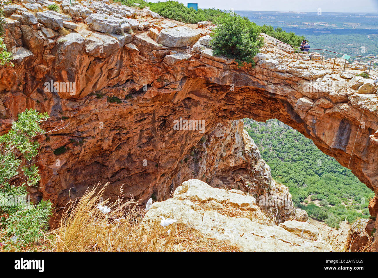 Hikers at the Keshet Cave (Arch Cave) in Adamit Park, Western Galilee ...