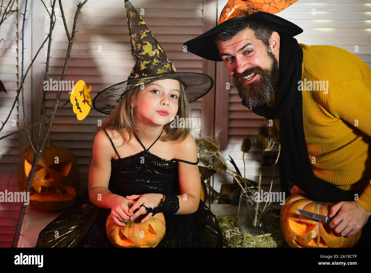 Father and daughter with Halloween decor. Halloween party concept ...