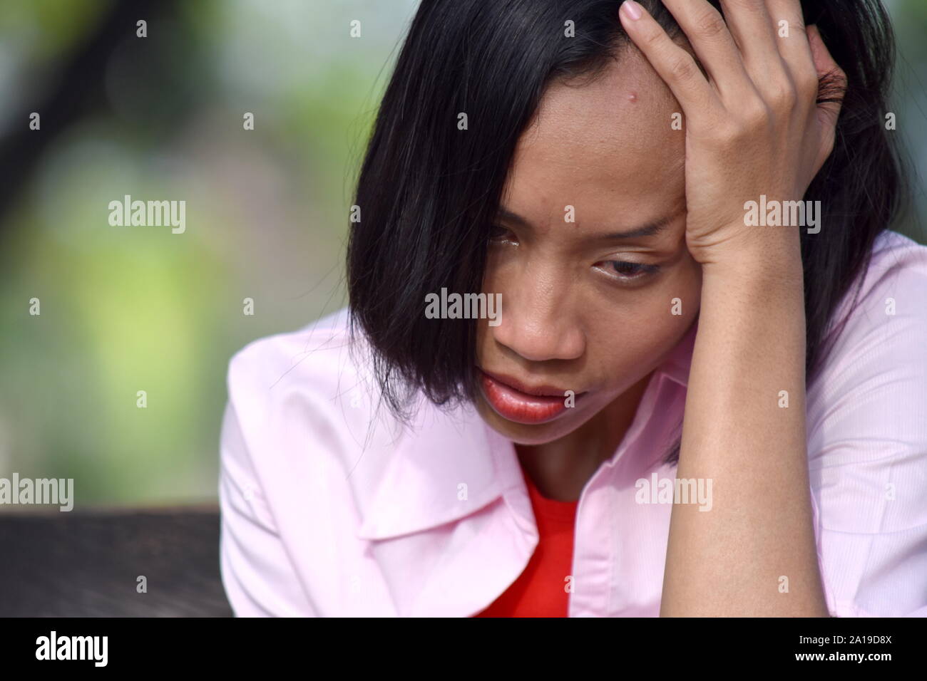 Beautiful sad female filipino hi-res stock photography and images - Alamy