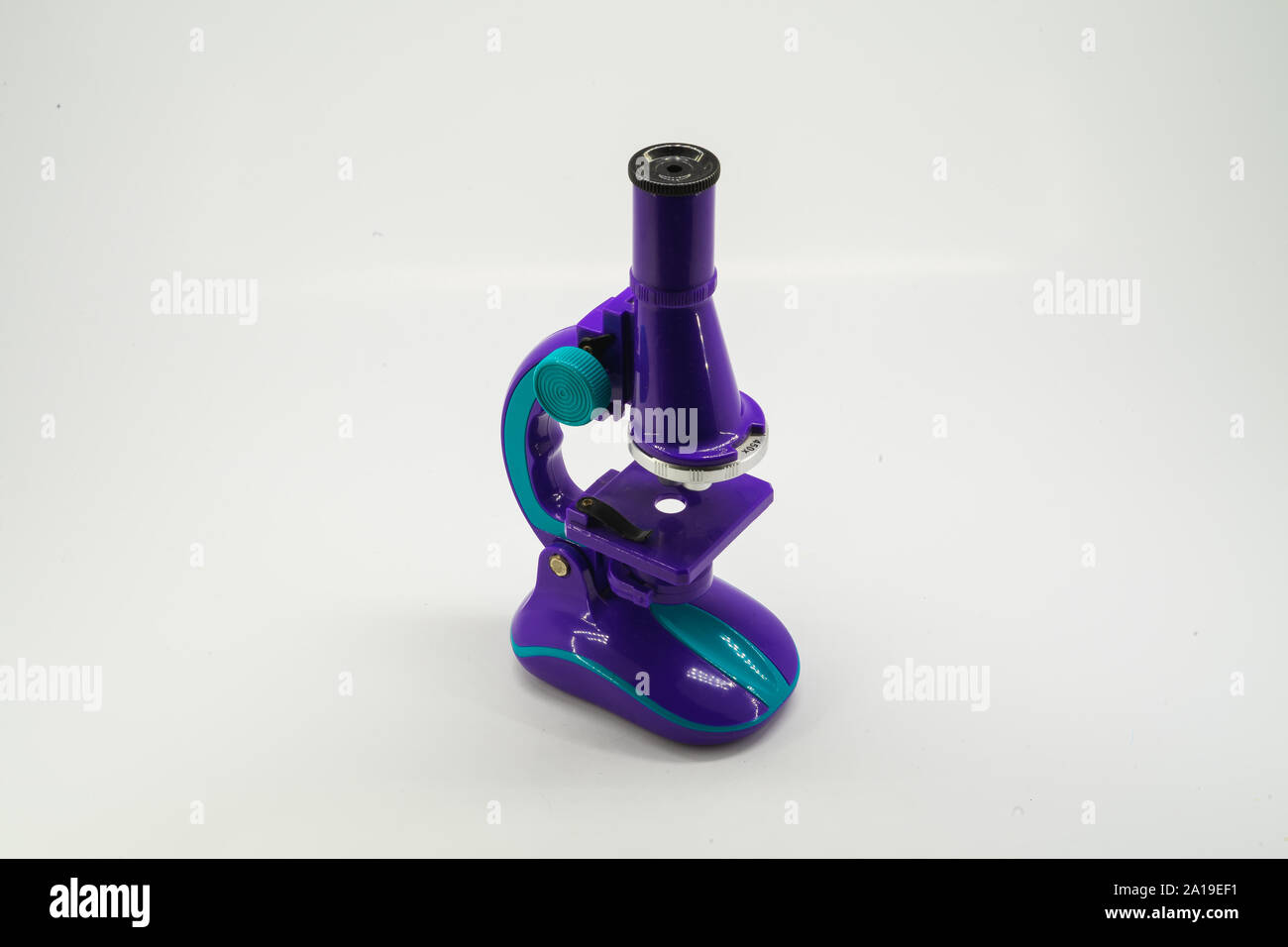 Purple microscope isolated on white Stock Photo - Alamy