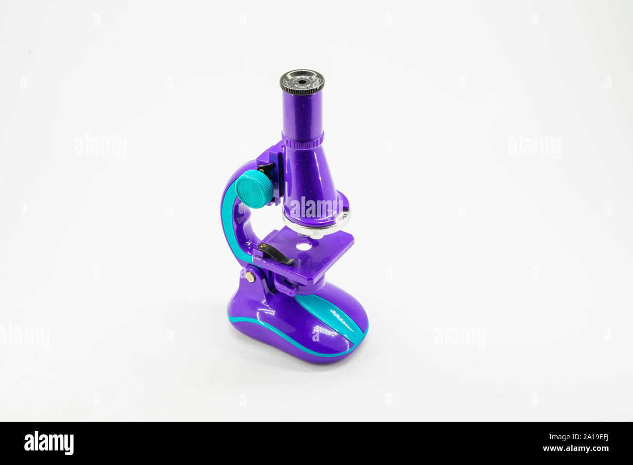 Purple microscope isolated on white Stock Photo - Alamy