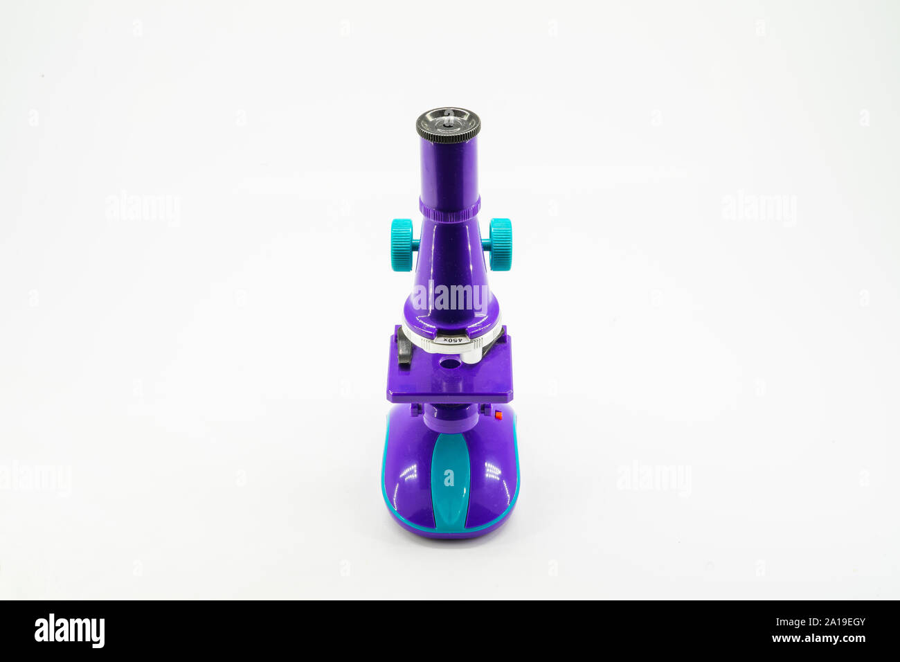 Purple microscope isolated on white Stock Photo - Alamy