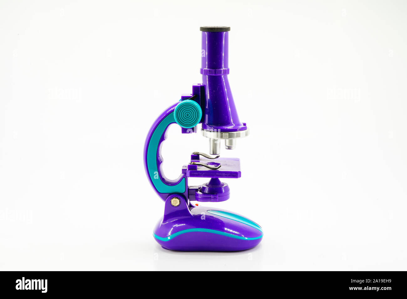 Purple microscope isolated on white Stock Photo - Alamy