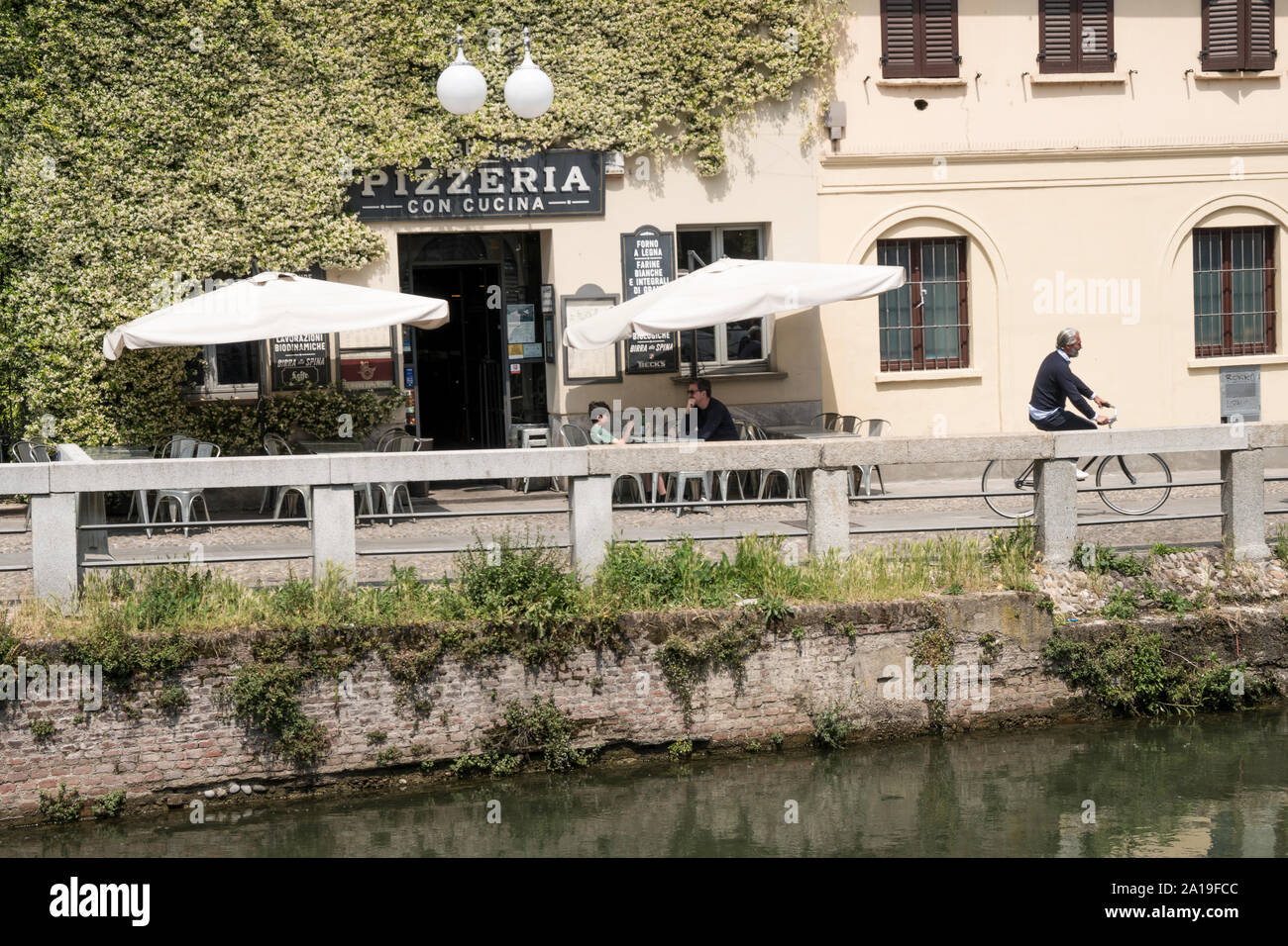 Milan, Italy: Italian pizzeria in ancient building, with the facade ...