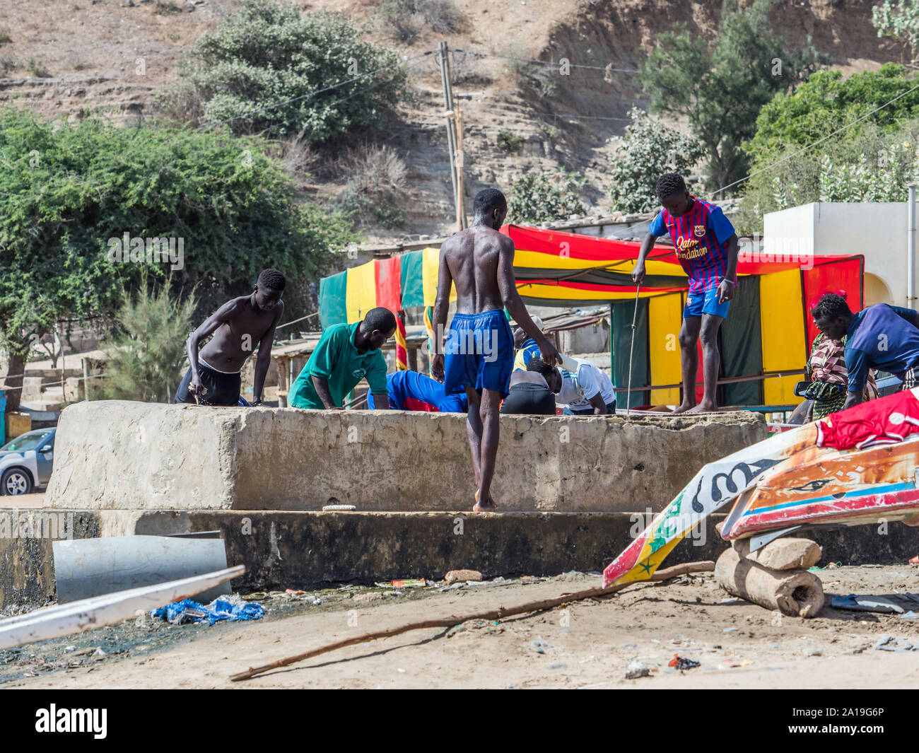 Dakar, Senegal - February 2, 2019: African boys pull water from a well ...