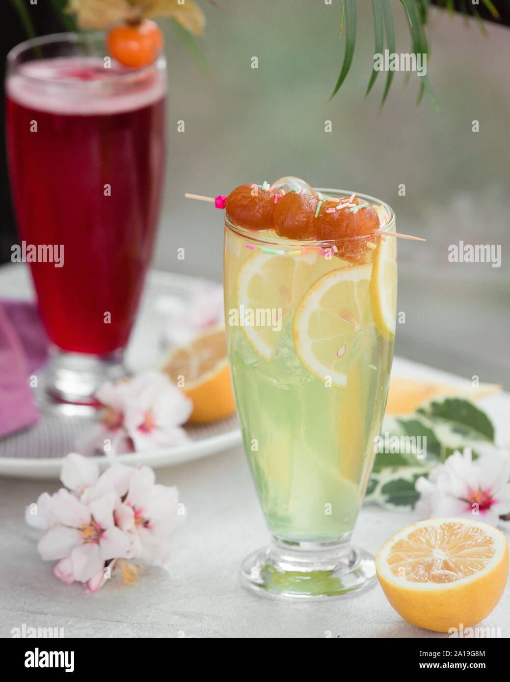 Lemon cocktail with fruit slices Stock Photo - Alamy