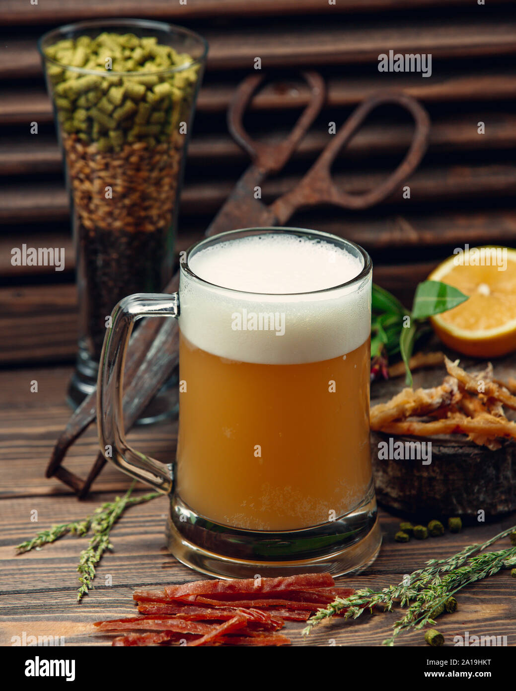 Glass of cold filtered beer with foam Stock Photo - Alamy