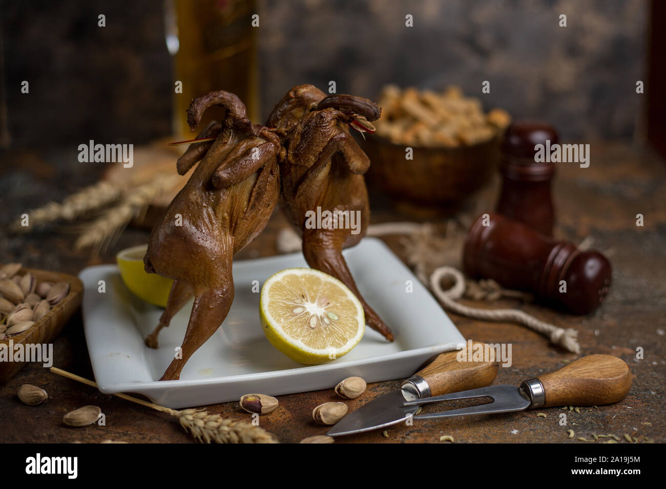 Two fried quailes in front of each other Stock Photo - Alamy
