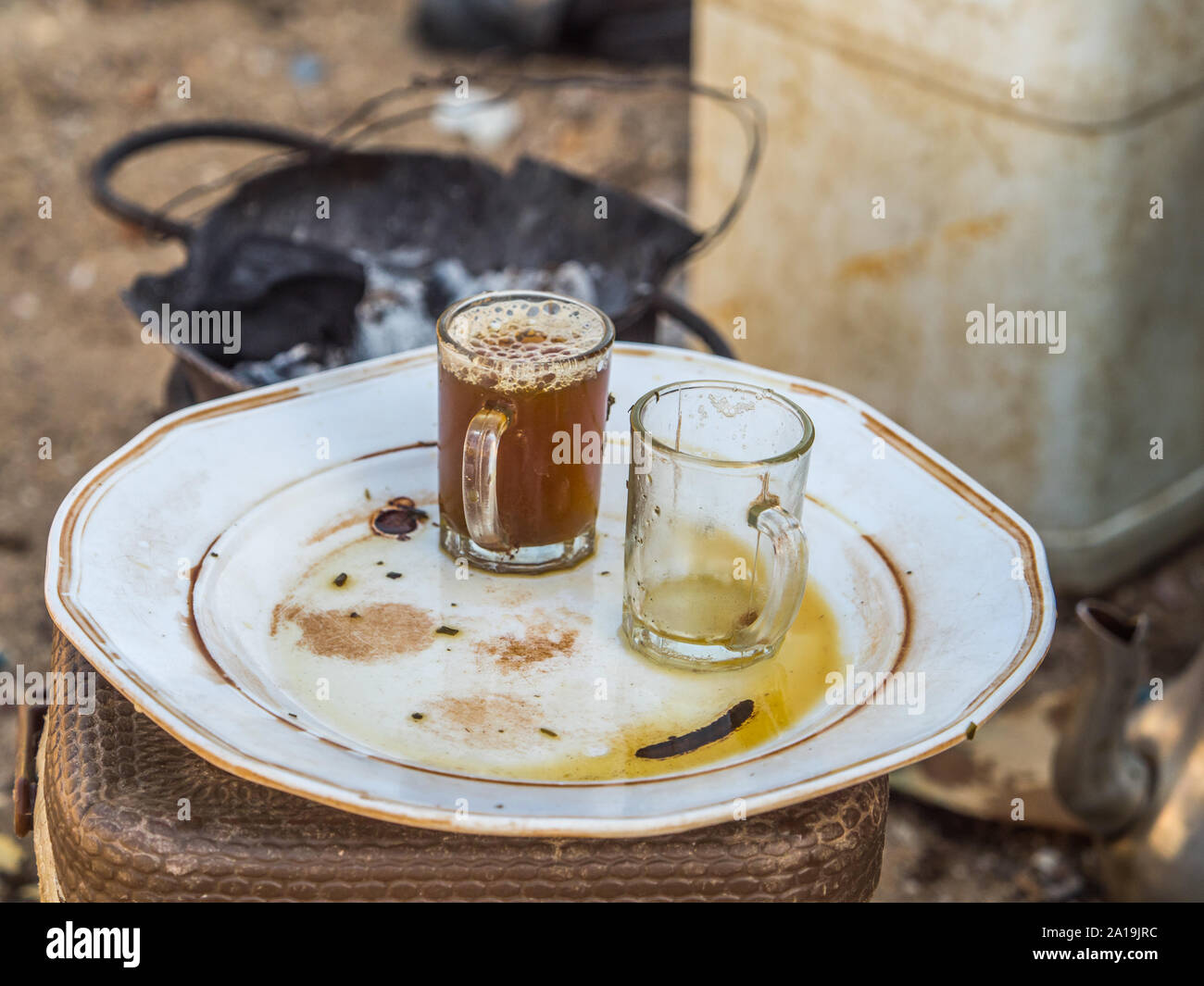 Two small glasses of traditional senegalese tea called 'Ataya' in Wolof ...
