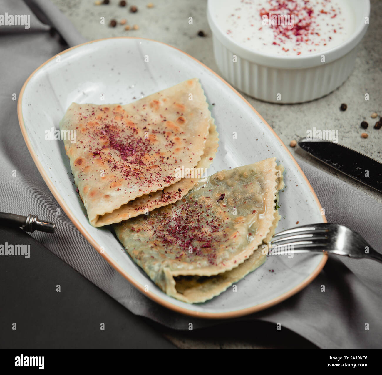 Traditional azerbaijani gutabs with sumakh Stock Photo - Alamy