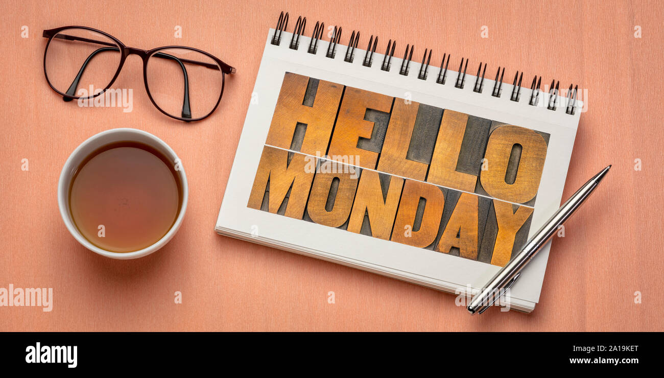 Hello Monday cheerful banner - letterpress wood type text in a notebook ...