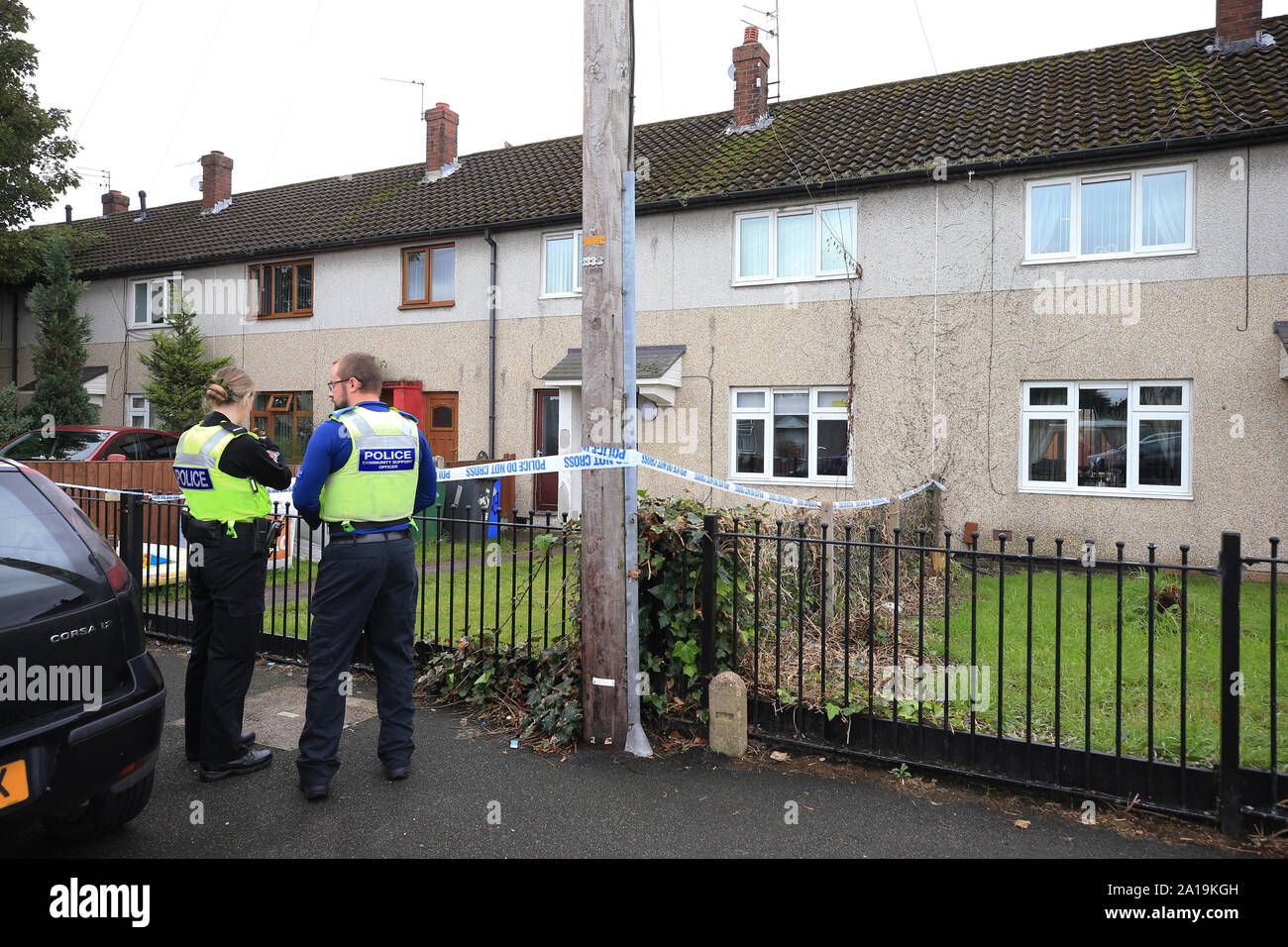 Police officers at a property on Graham Road in Widnes in Cheshire ...