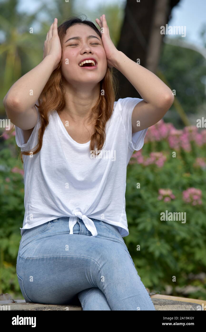 A Beautiful Asian Female Under Stress Stock Photo - Alamy
