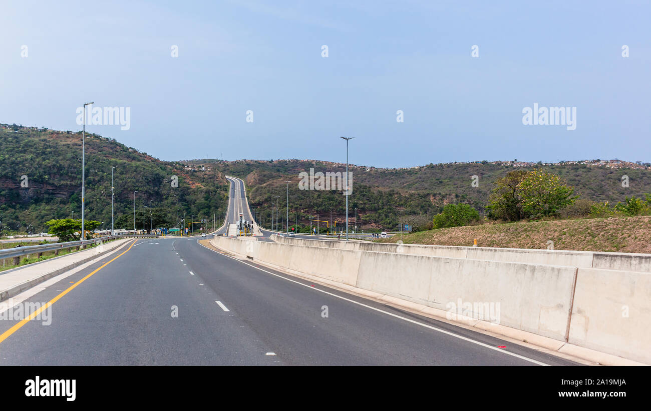New road highway dual vehicle lanes bus stops driving perspective ...