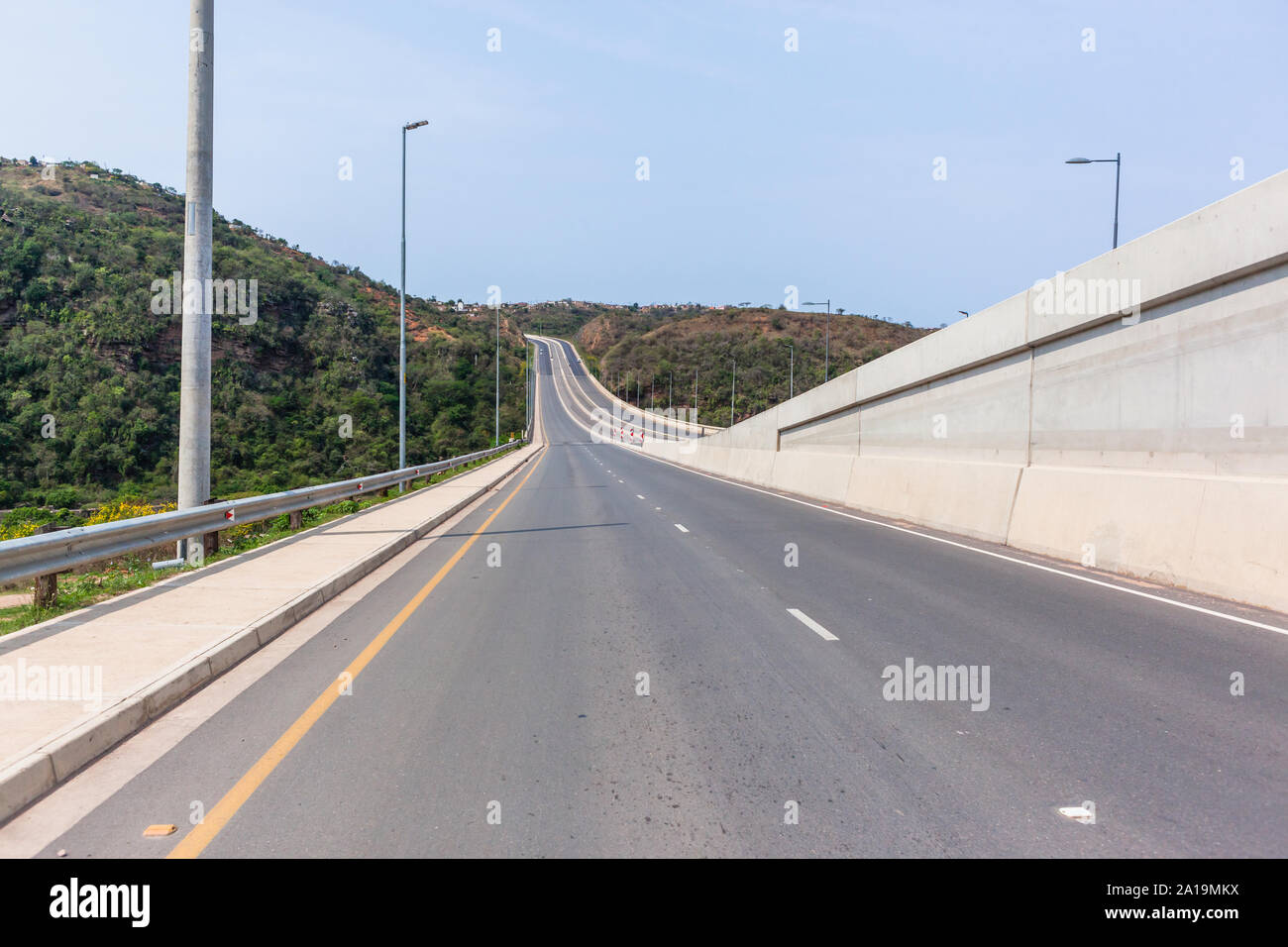 New road highway dual vehicle lanes bus stops driving perspective ...