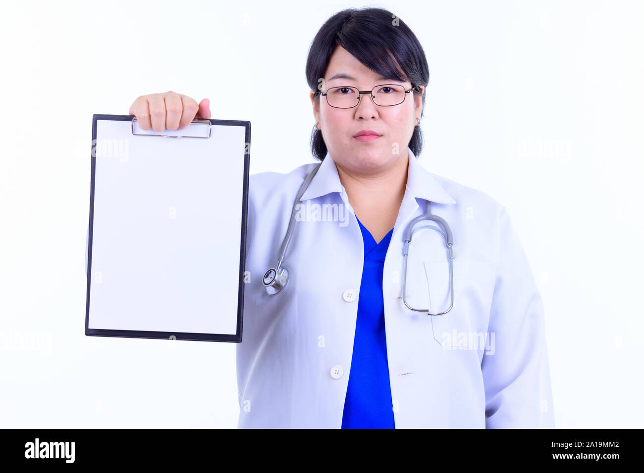 Beautiful overweight Asian woman doctor showing clipboard Stock Photo ...