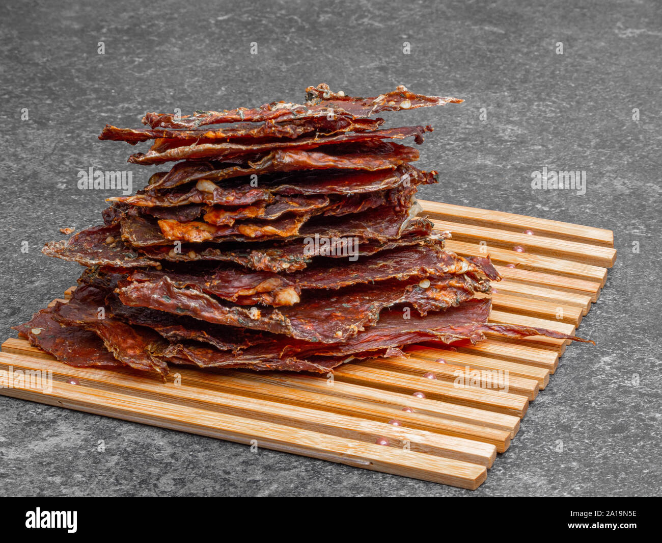 dried meat pieces, dehydrateed slices in spices Stock Photo - Alamy