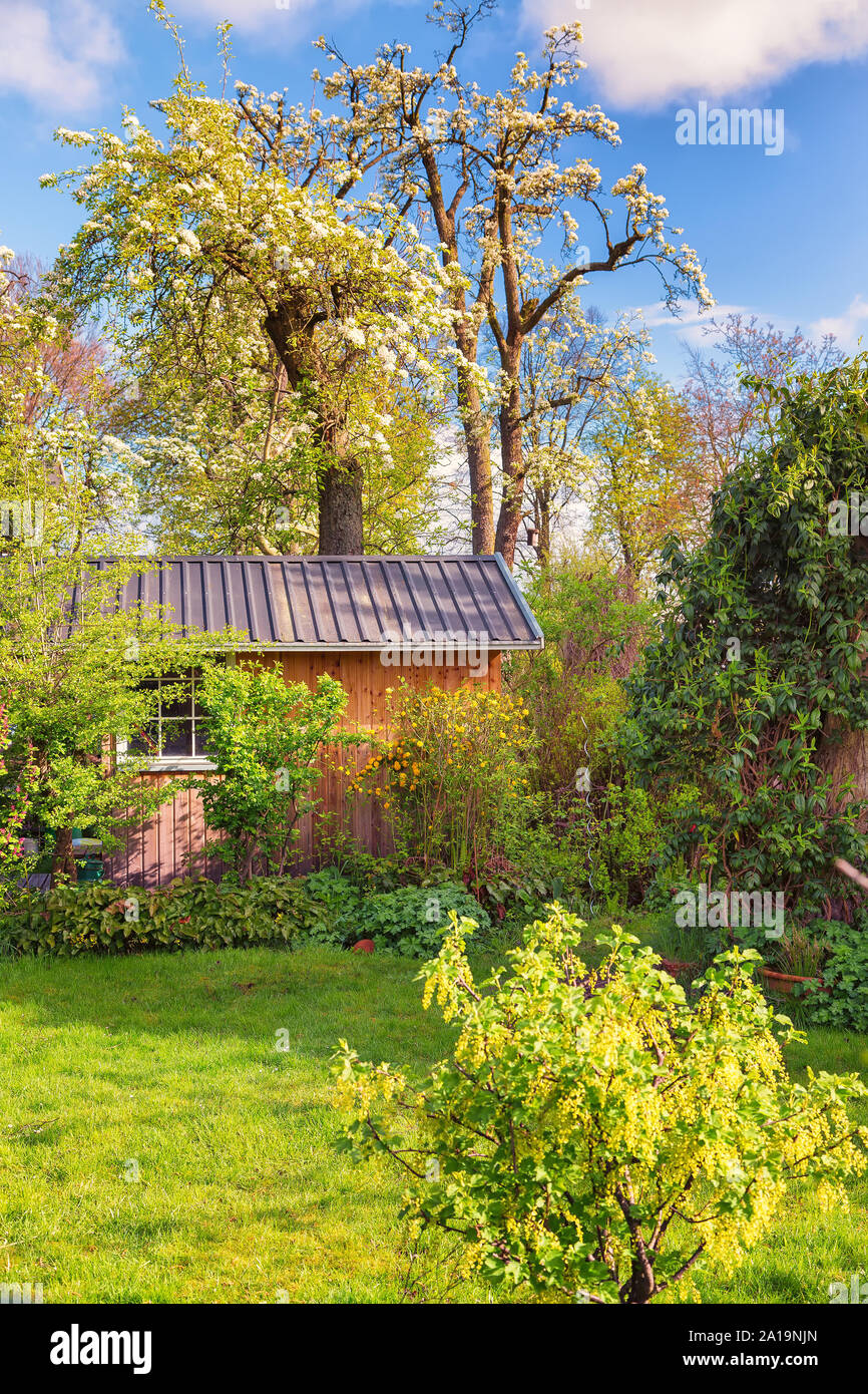House in spring garden hi-res stock photography and images - Alamy
