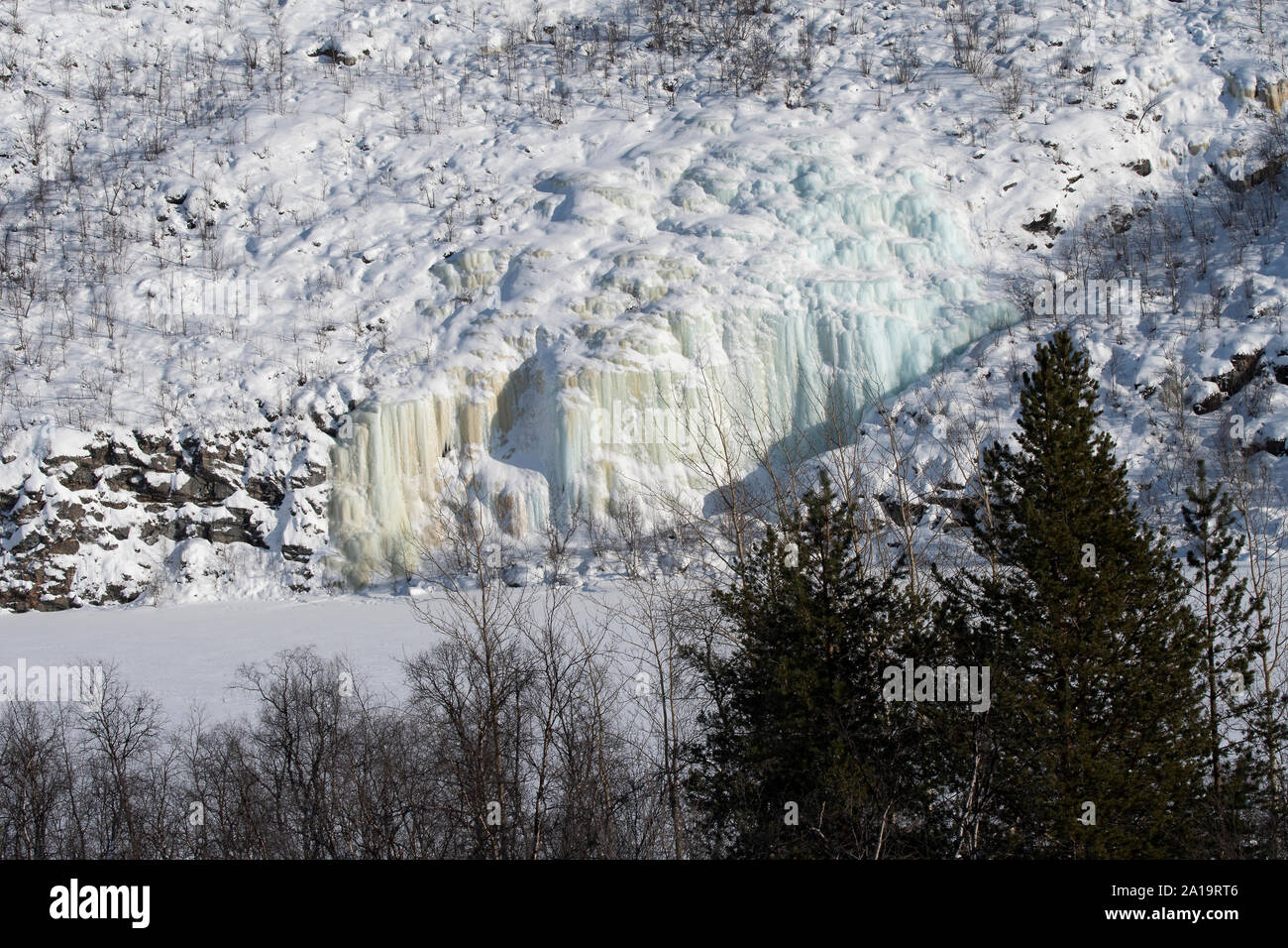 Winter scenery around Kaamanen, frozen waterfall and lake, Arctic ...
