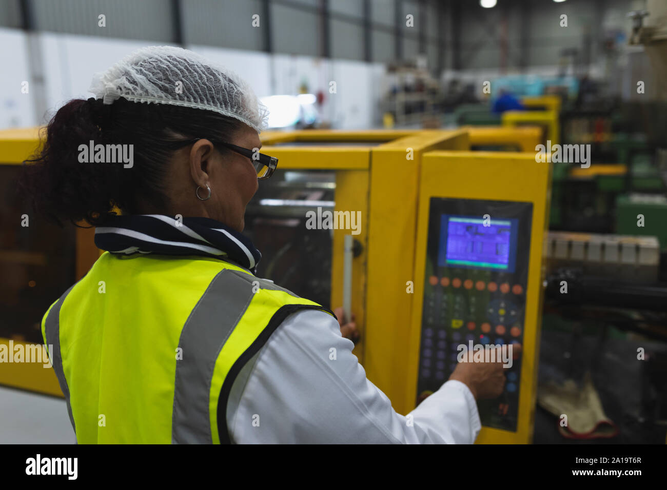 Female factory worker hi-res stock photography and images - Alamy